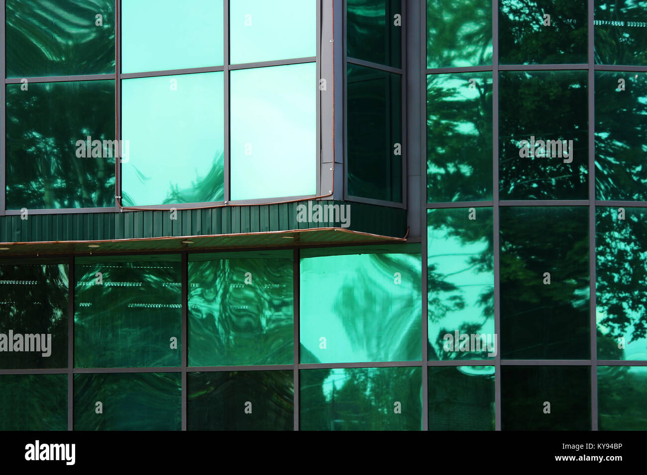 Large green glass windows in the city shopping center Stock Photo - Alamy