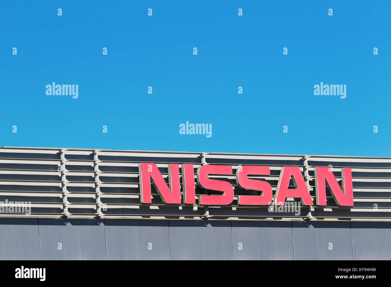 Nissan company name in front of dealership building on November 14 ...