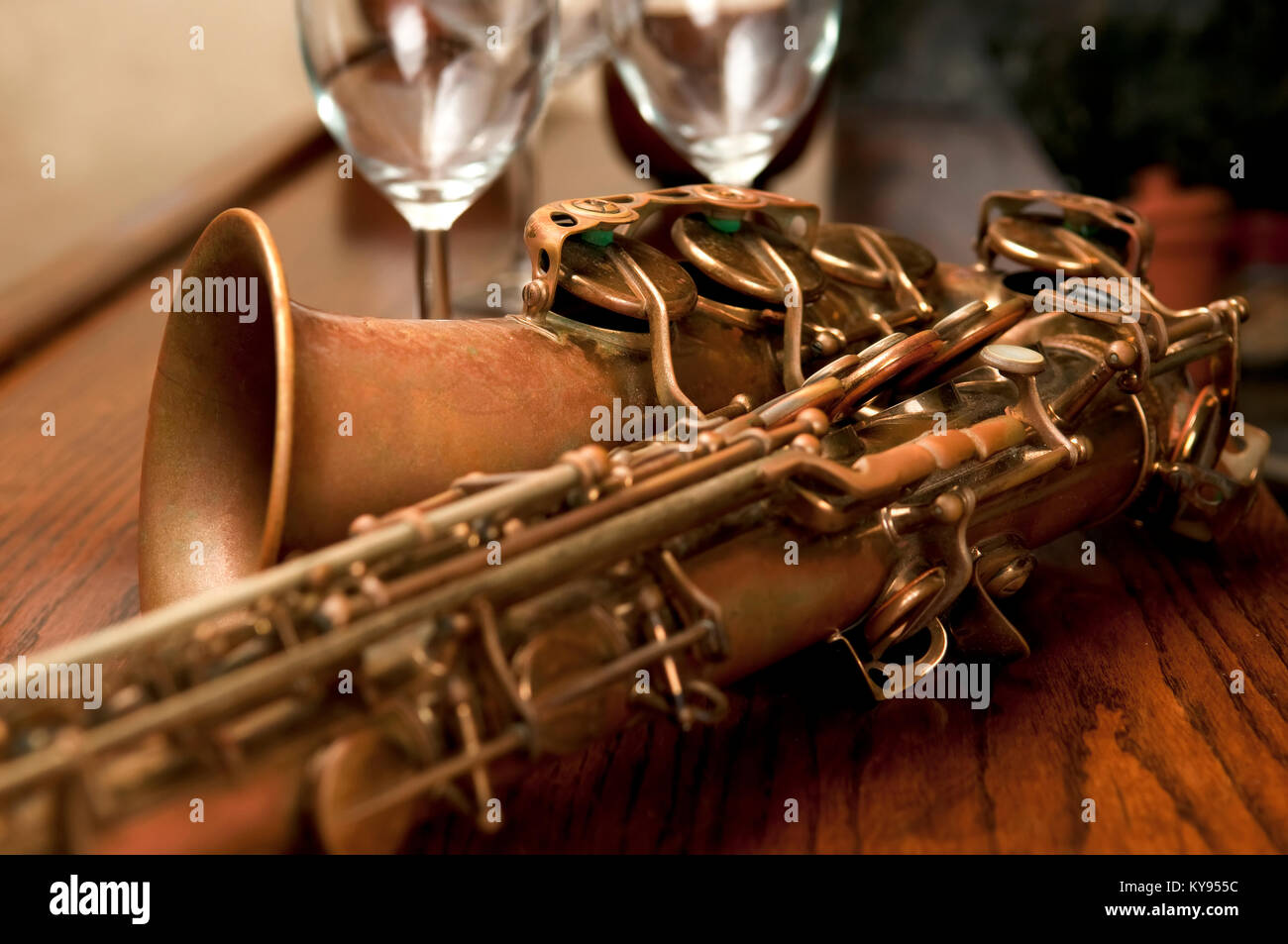 closeup on old, antique alto saxophone on wood bar Stock Photo - Alamy