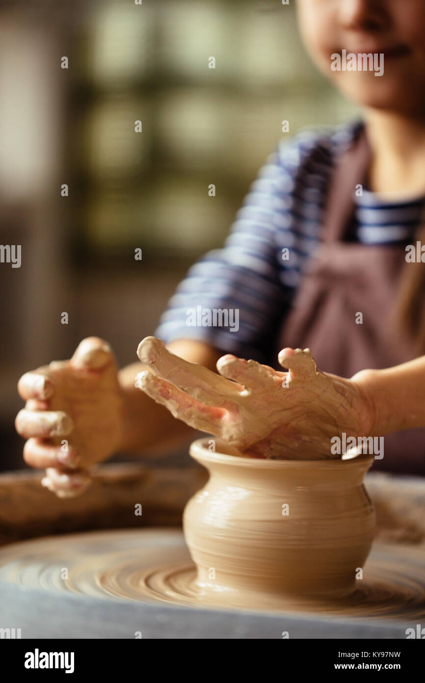 Hands of young potter, close up hands made cup on pottery wheel Stock ...