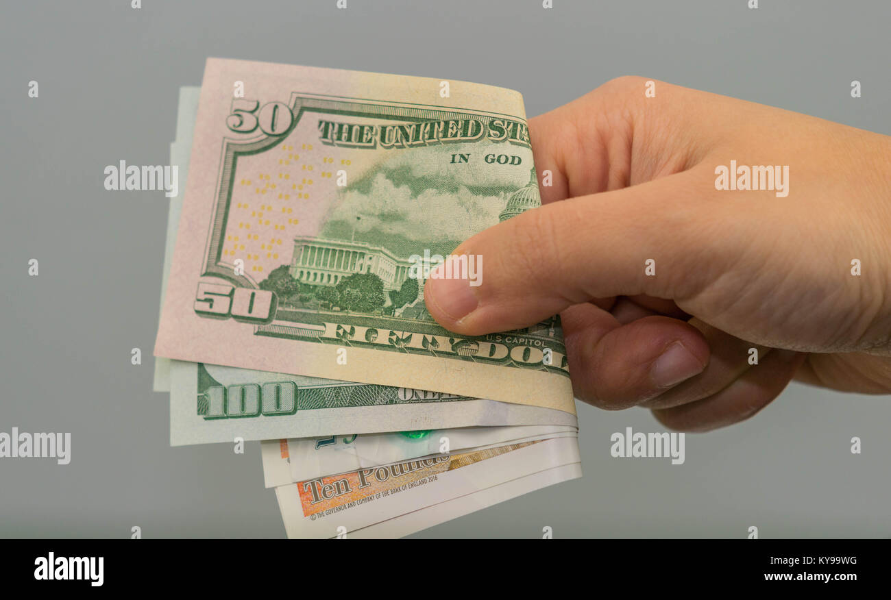 Money in the hand Hand with money, Hand holding Banknotes Stock Photo ...