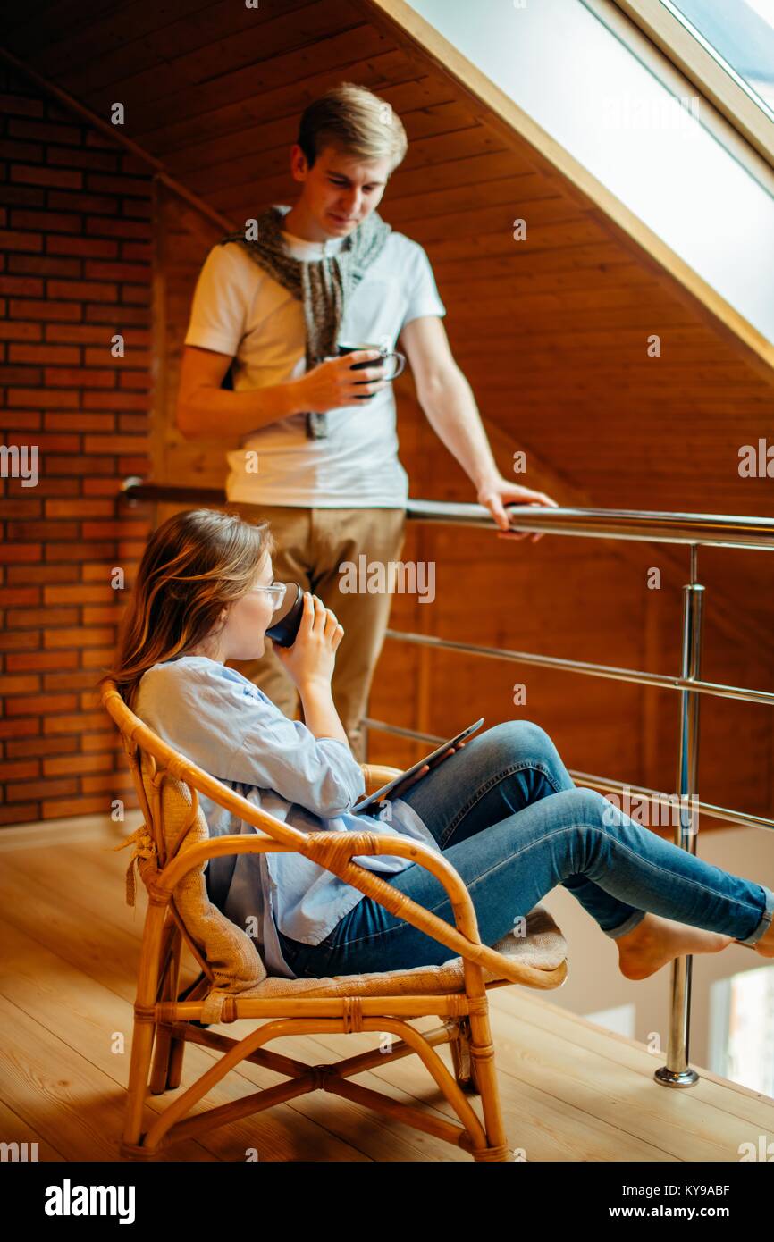 couple talking about something while drinking coffee Stock Photo - Alamy