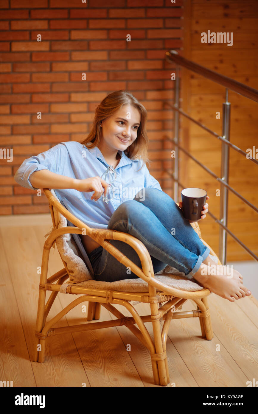 woman sitting and drinking tea Stock Photo - Alamy
