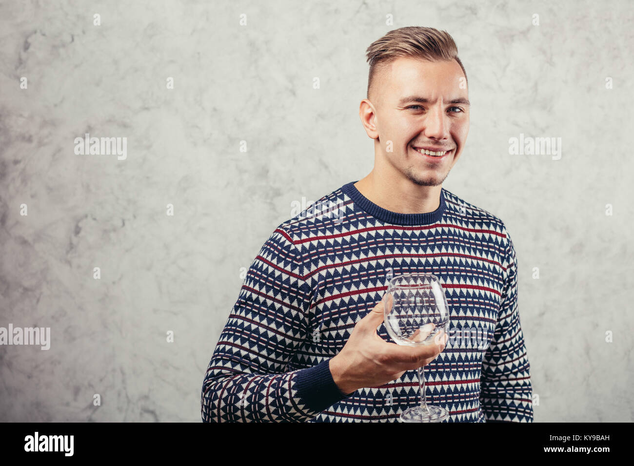 man holding empty wine glass Stock Photo - Alamy