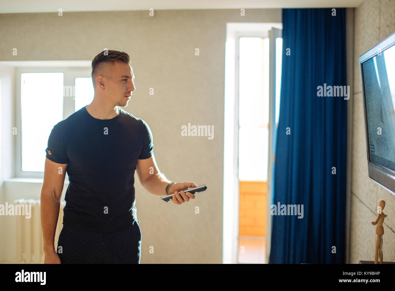 Man with tv remote control hi-res stock photography and images - Alamy