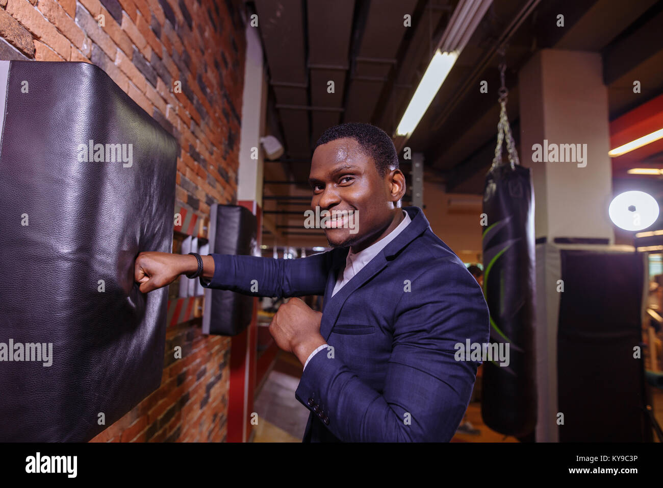 person wearing business suit and boxing gloves Stock Photo - Alamy