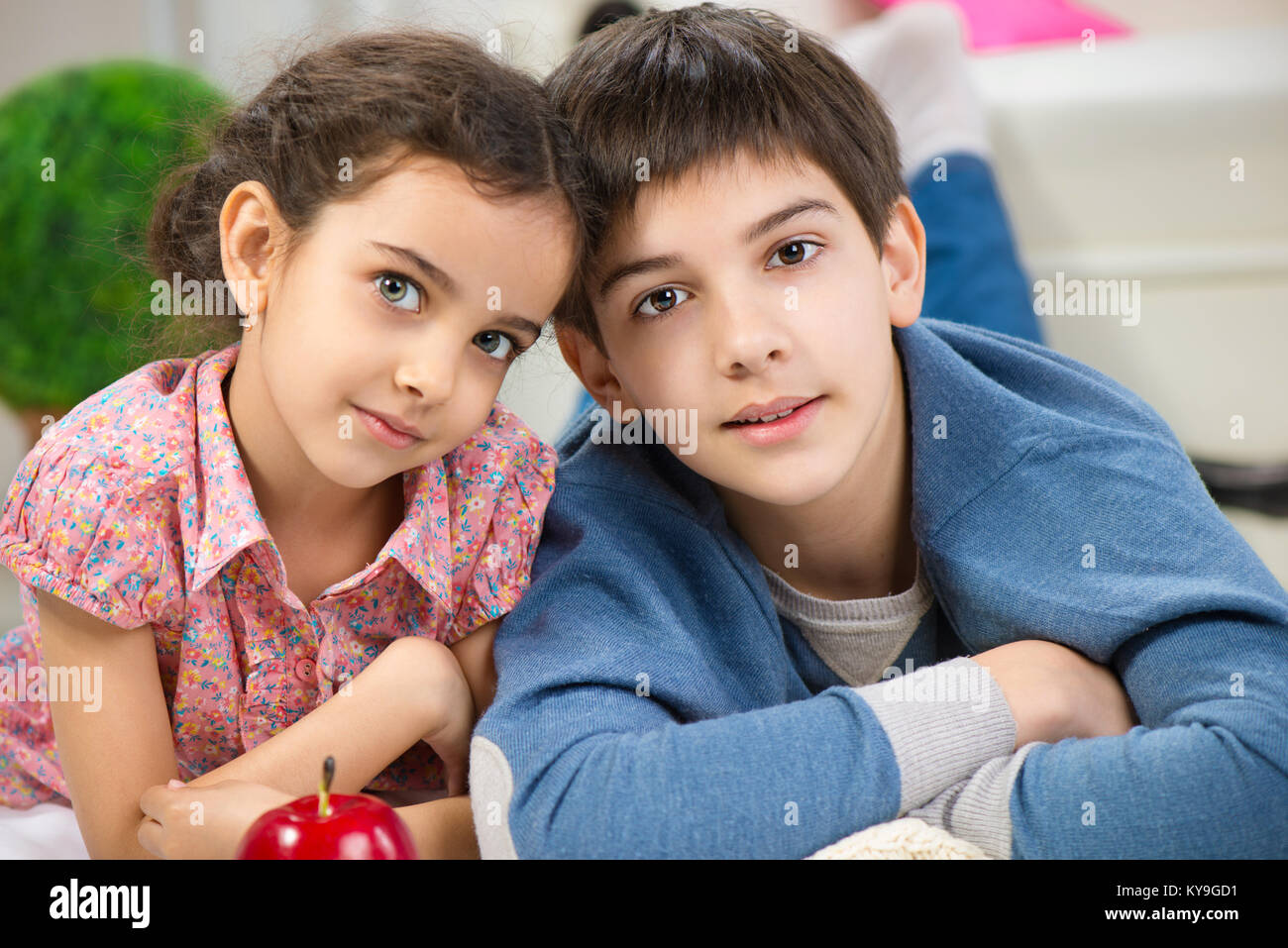 Happy brother and cute little sister at home Stock Photo - Alamy