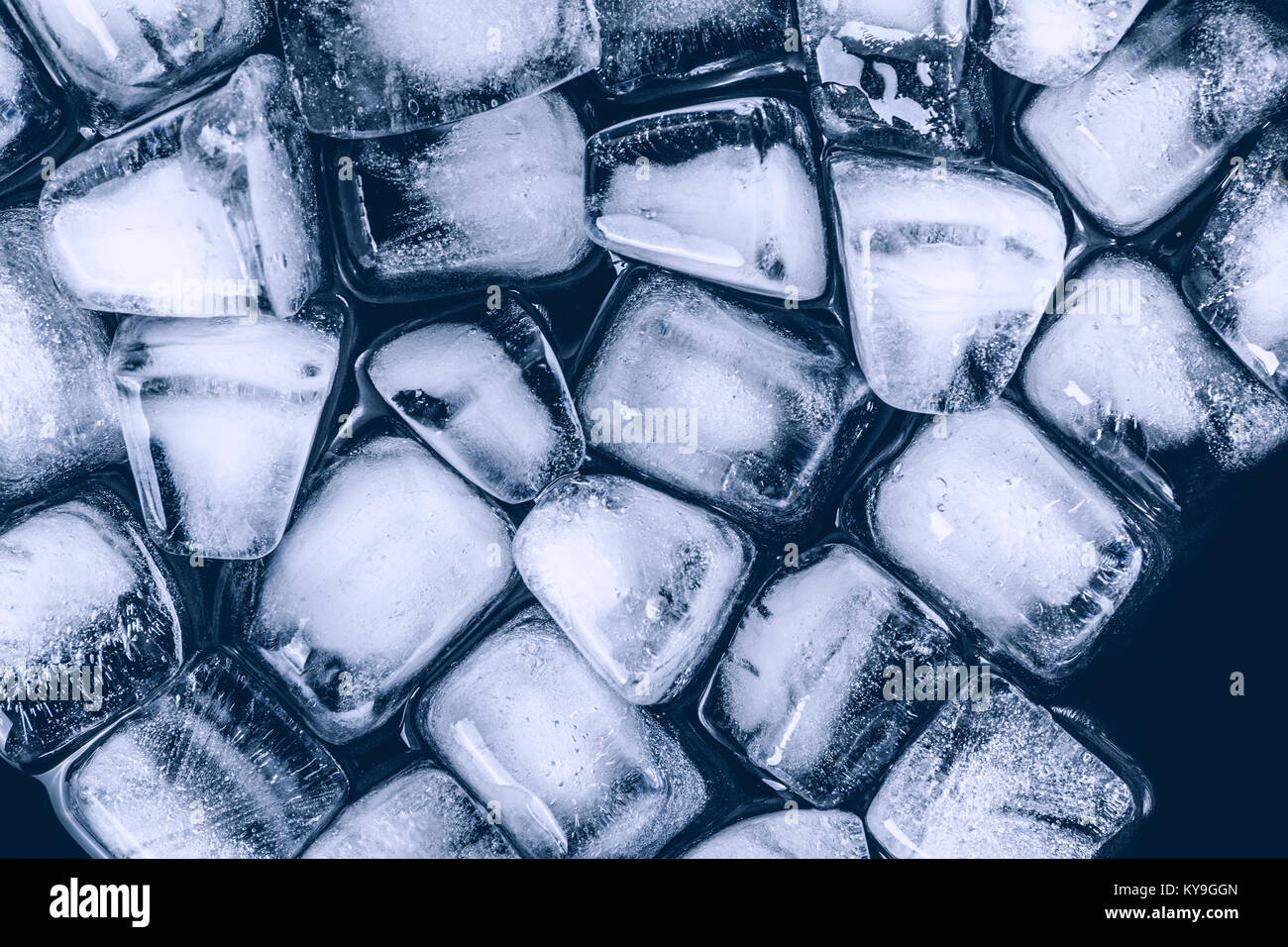 Texture of ice cubes on a dark background. Chaotic scattered icicles on ...