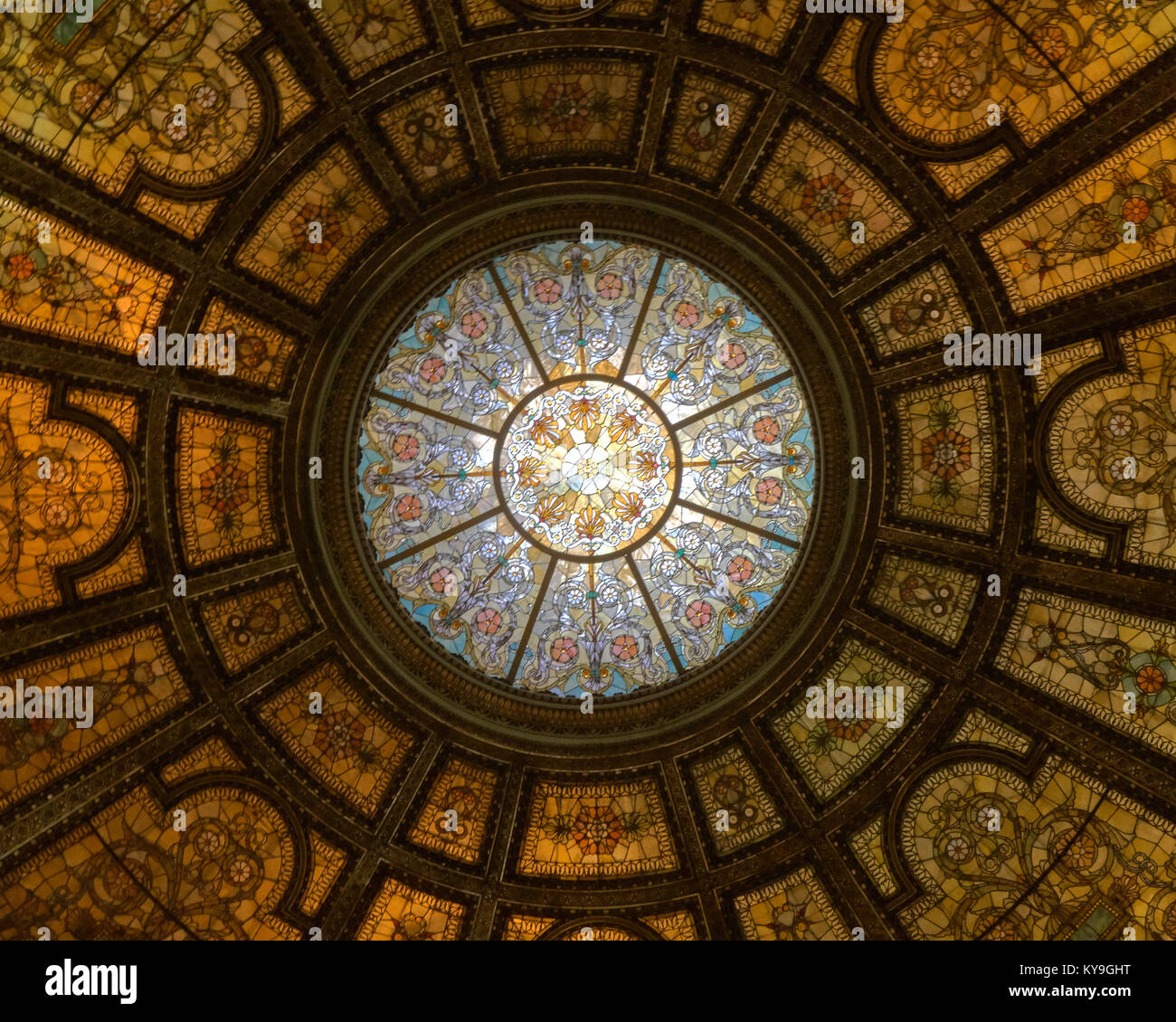 looking up at the domed Tiffany ceiling of the Cultural Center in ...