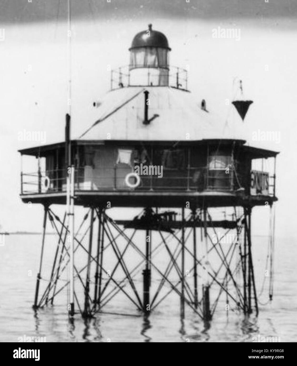 A boat is rowing toward the Pile Light in Moreton Bay, Australia ...
