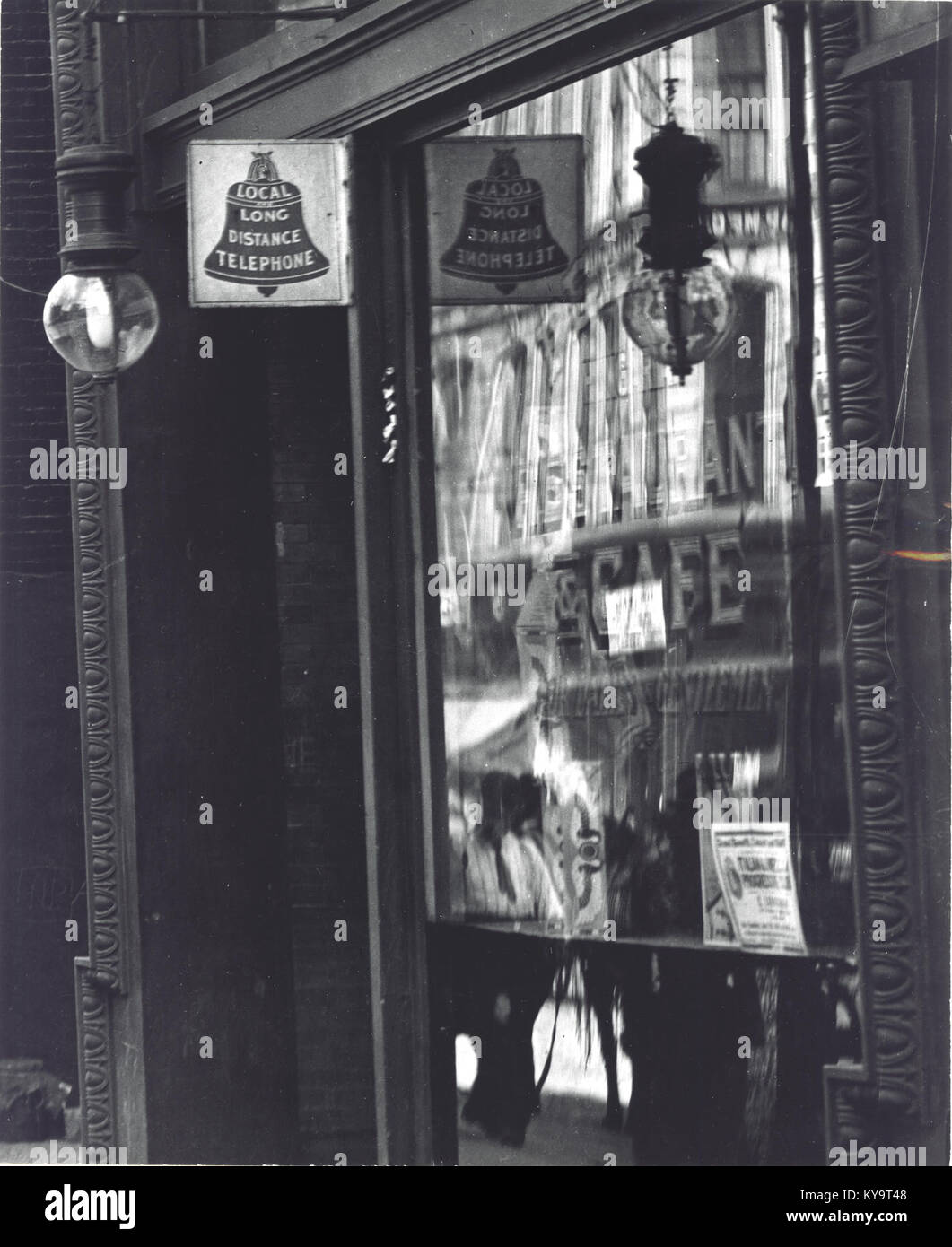 Telephone sign outside of the window of an unidentified restaurant and ...