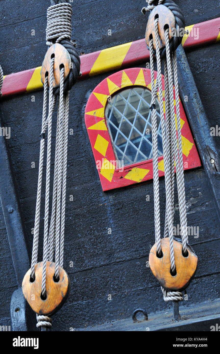 some blocks and tackles with red and yellow painted hatches and ...