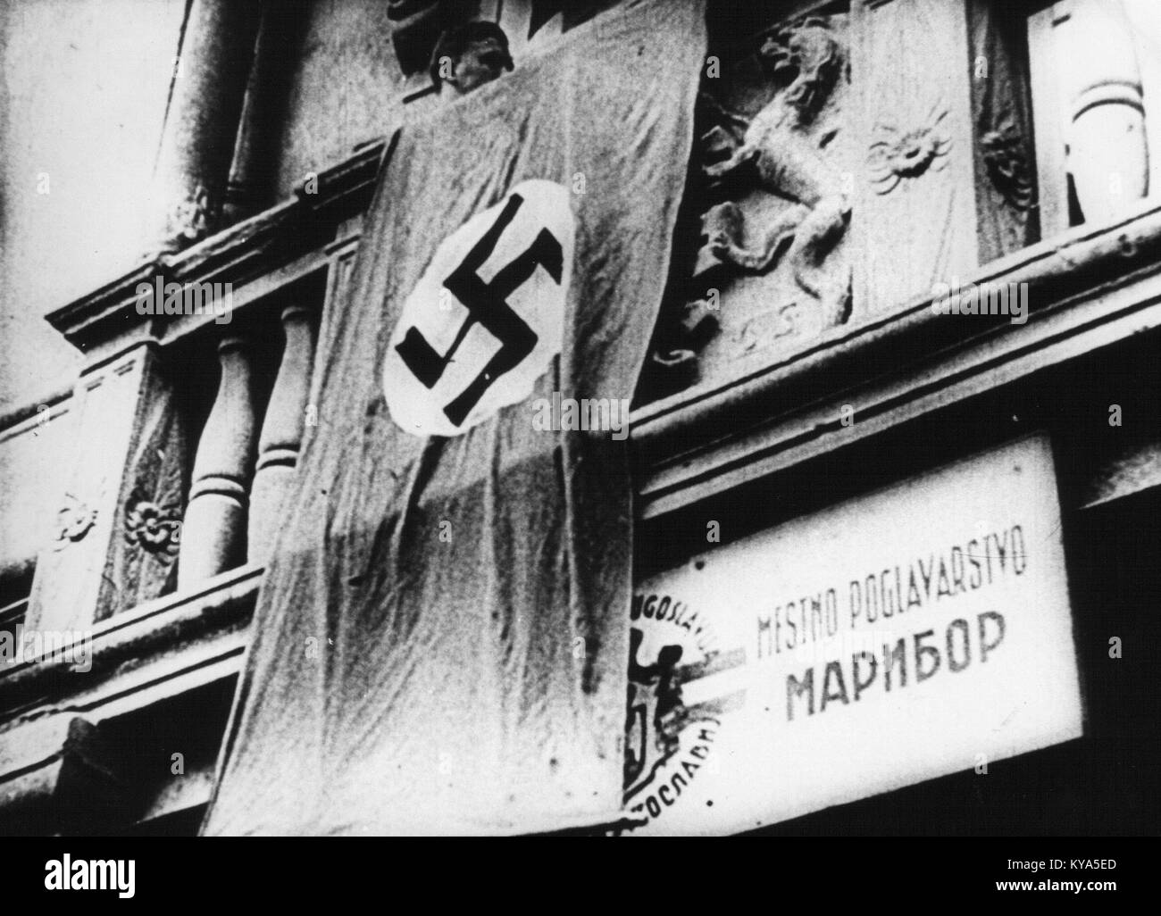 The image shows the Nazi flag at Maribor town hall during World War II ...