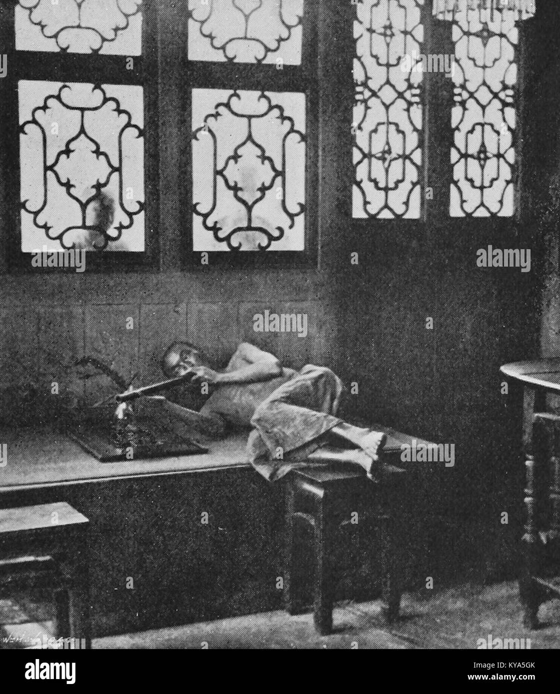 This image depicts the practice of opium smoking, a widespread activity ...