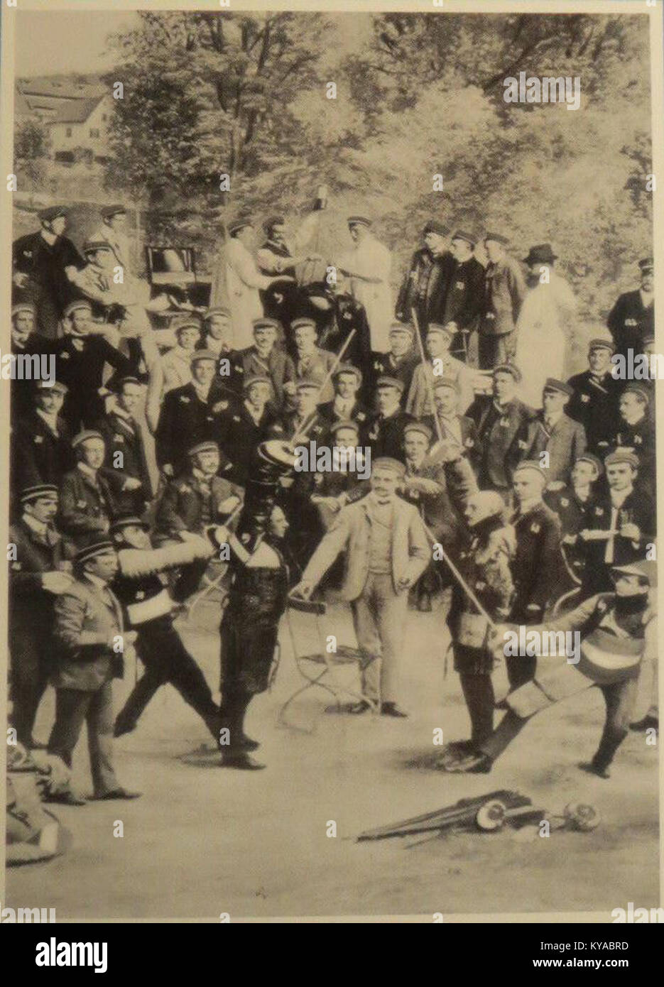 This historical image depicts a traditional academic fencing duel ...