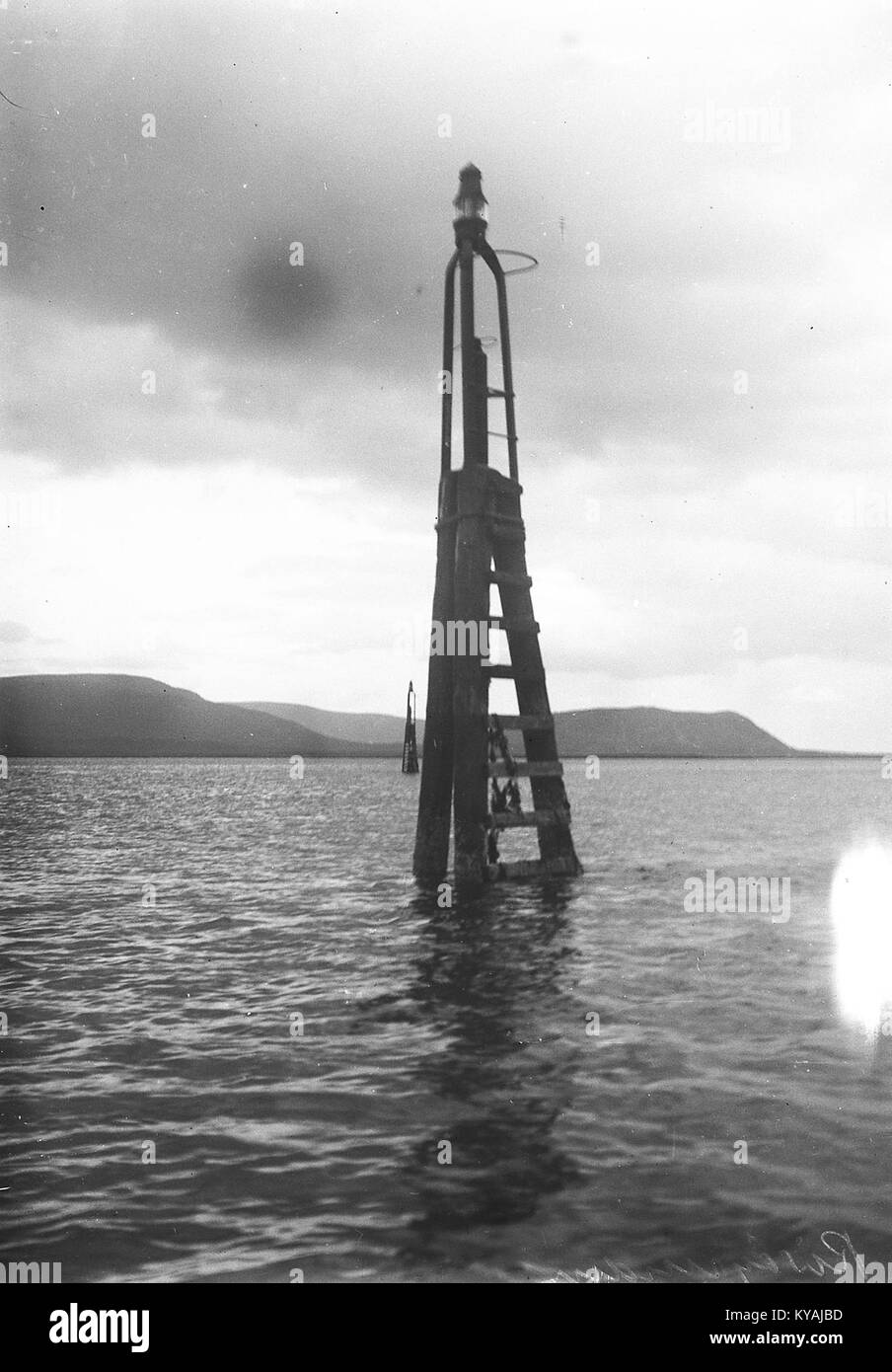 The photograph shows Ris-yrennen fyr lighthouse in Nordland, Norway ...