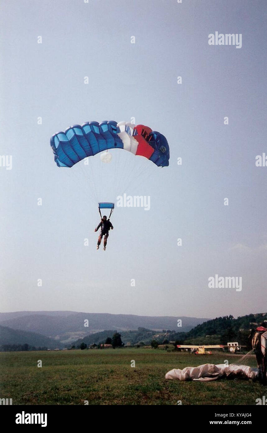 A description of a gliding parachute in motion, likely depicting the ...