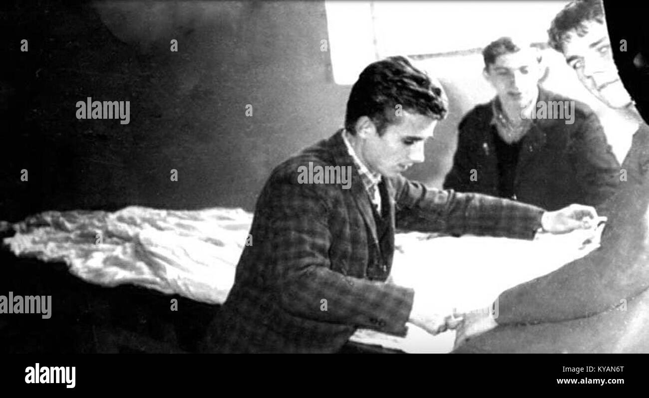 This image shows the process of folding a parachute on a table inside a ...