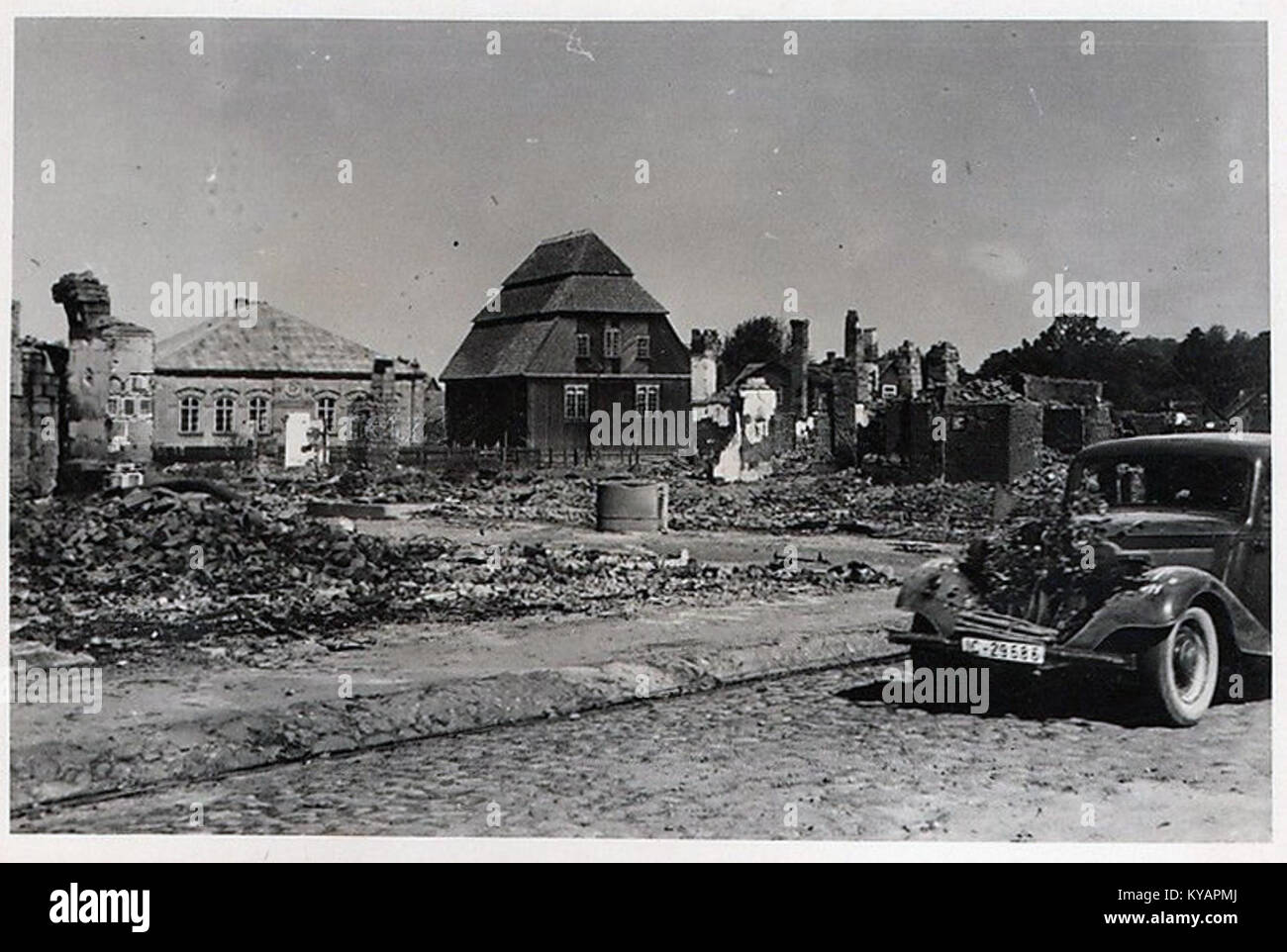A June 1941 photograph depicts ruins in Rietavas, Lithuania, reflecting ...