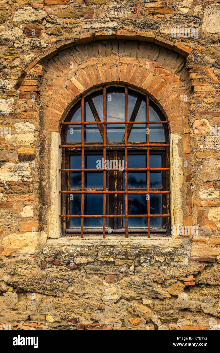 Detail of a medieval window of an old castle in Tuscany Stock Photo - Alamy