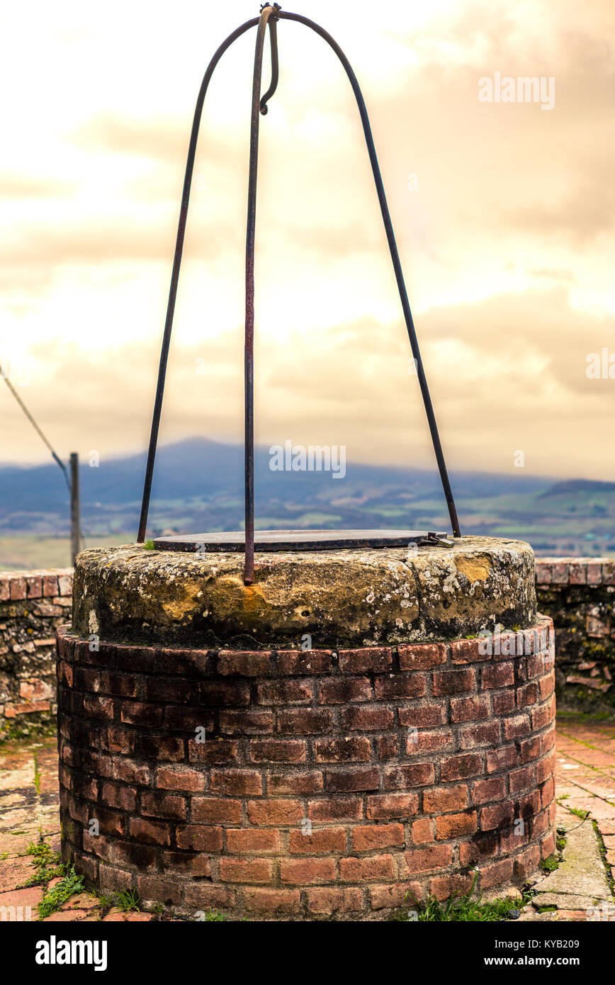 An old medieval water well of a typical medieval small village in ...