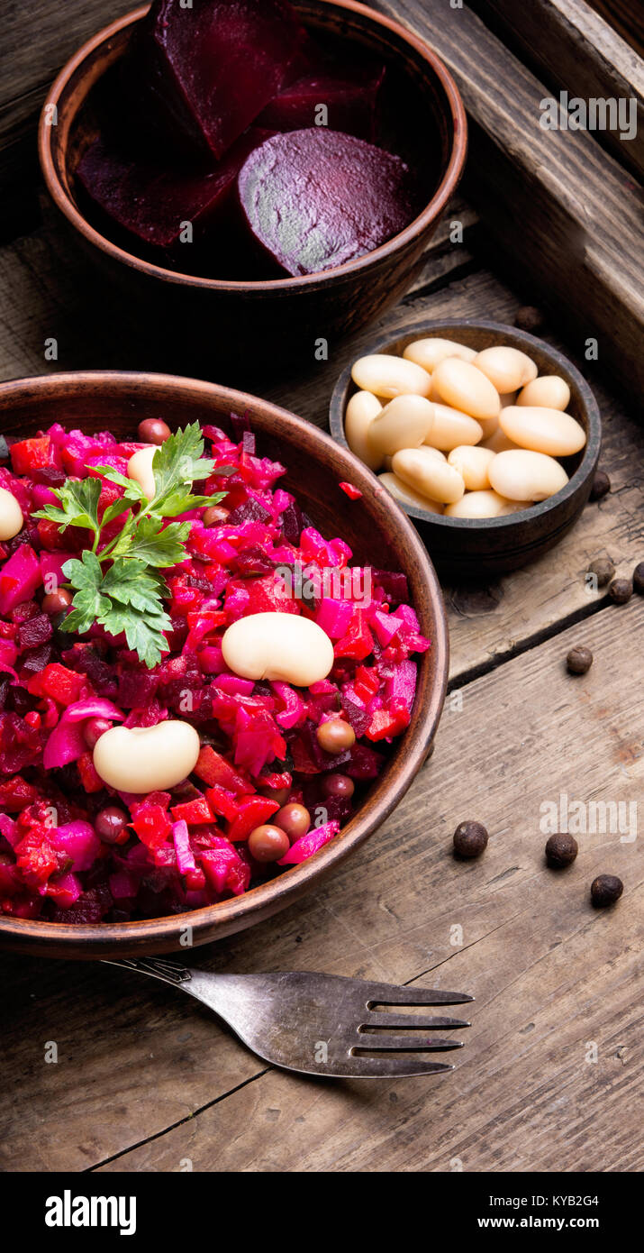 Traditional vegetarian russian beetroot salad vinaigrette in rustic ...