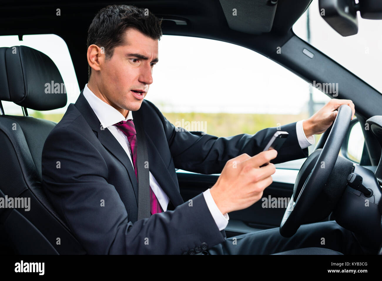 Man texting while driving by car Stock Photo - Alamy