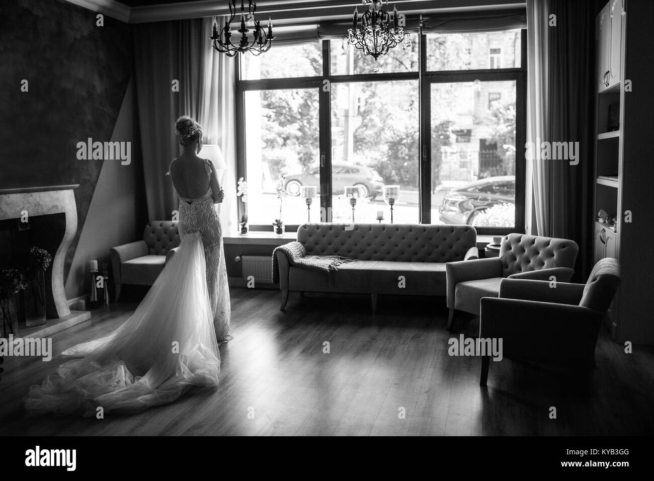 Woman stands near white Black and White Stock Photos & Images - Alamy