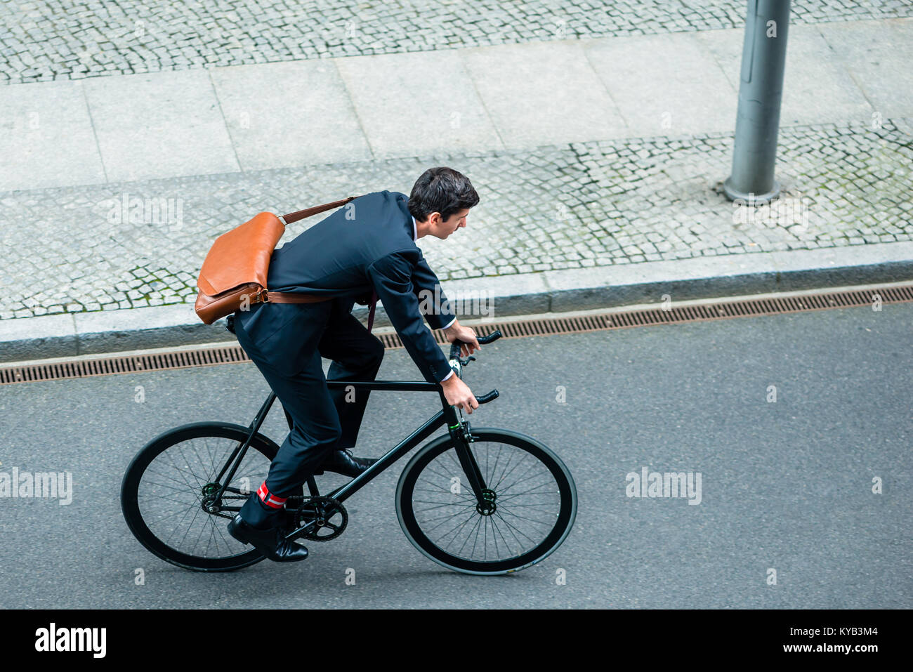 Young man wearing business suit while riding an utility bicycle Stock ...