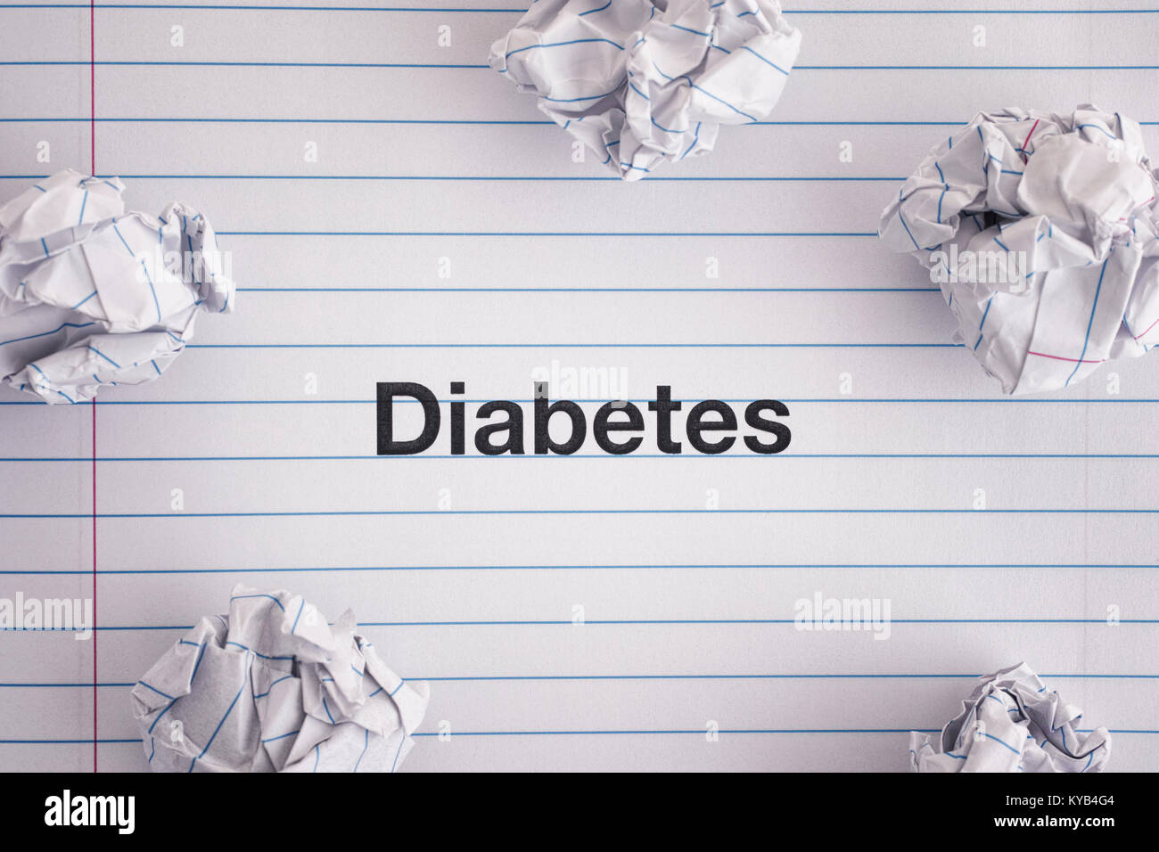 Diabetes. Word Diabetes on notebook sheet with some crumpled paper ...