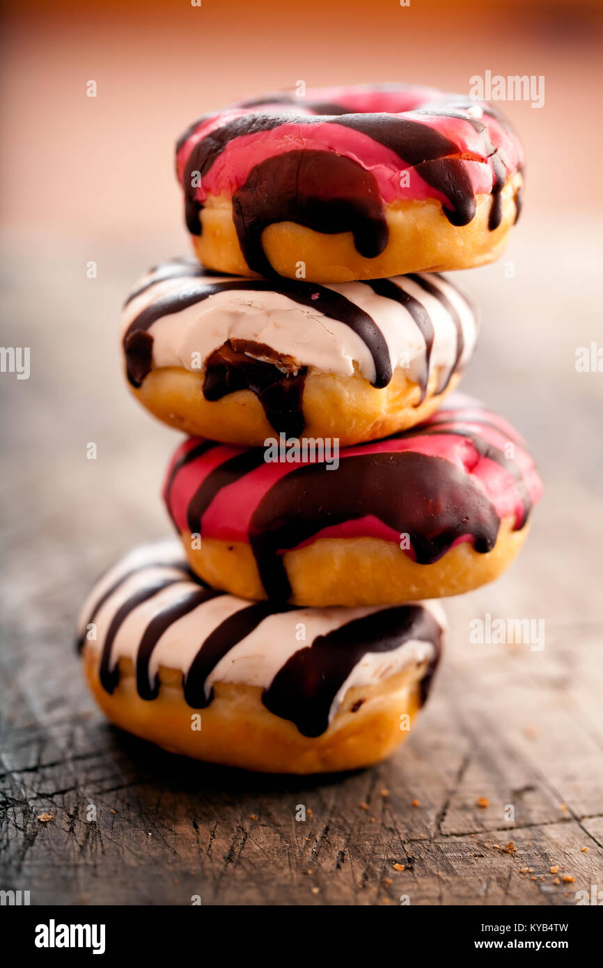 Stack of donuts with chocolate frosting and colorful sprinkles ...
