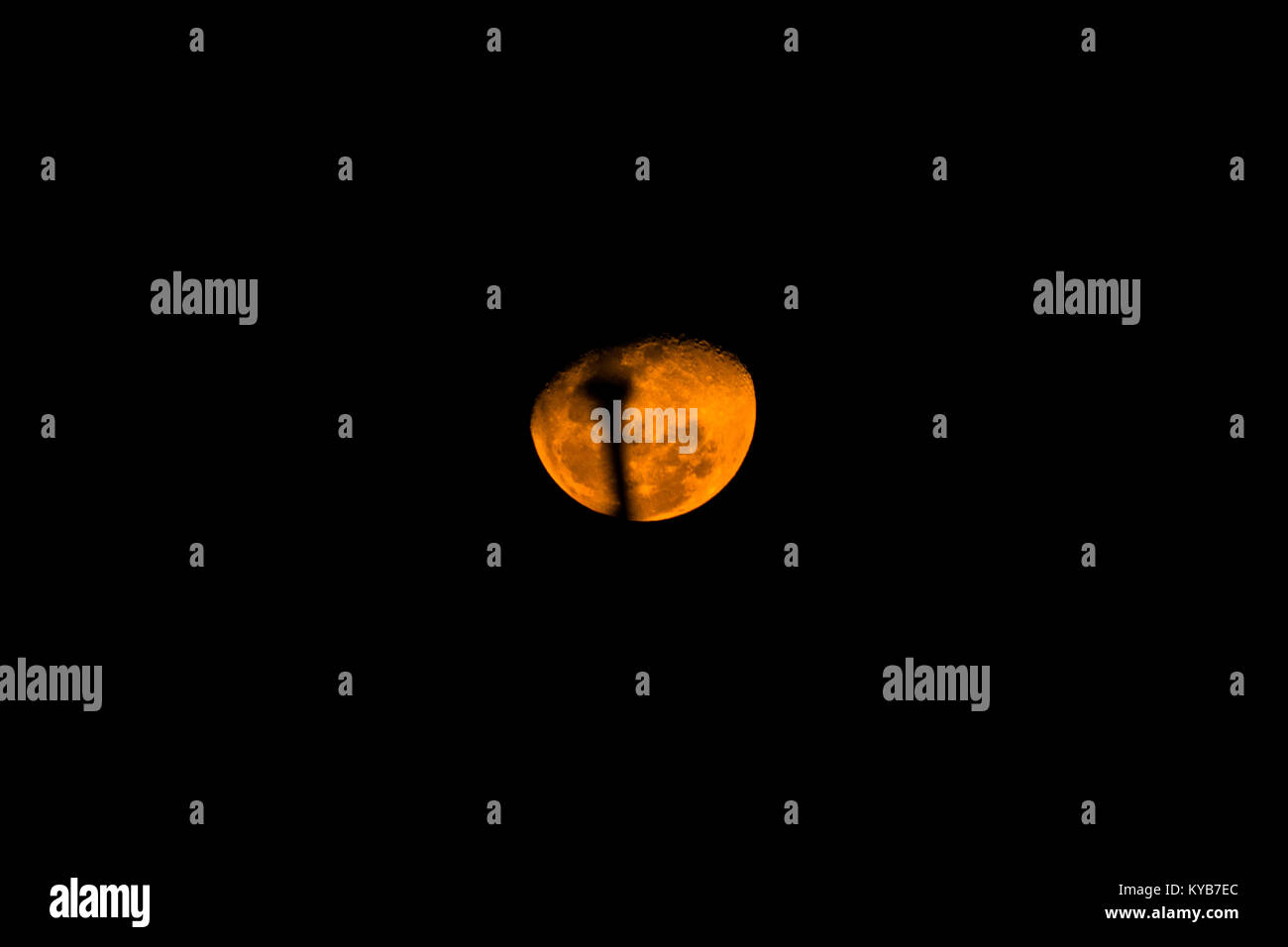 Moon in the night sky with an unusual hue Stock Photo - Alamy