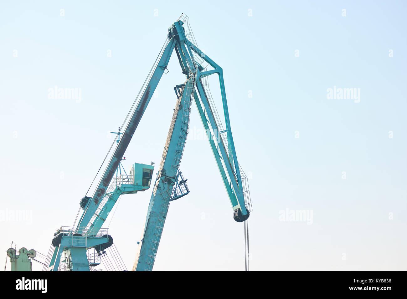 Blue crane against blue sky Stock Photo - Alamy