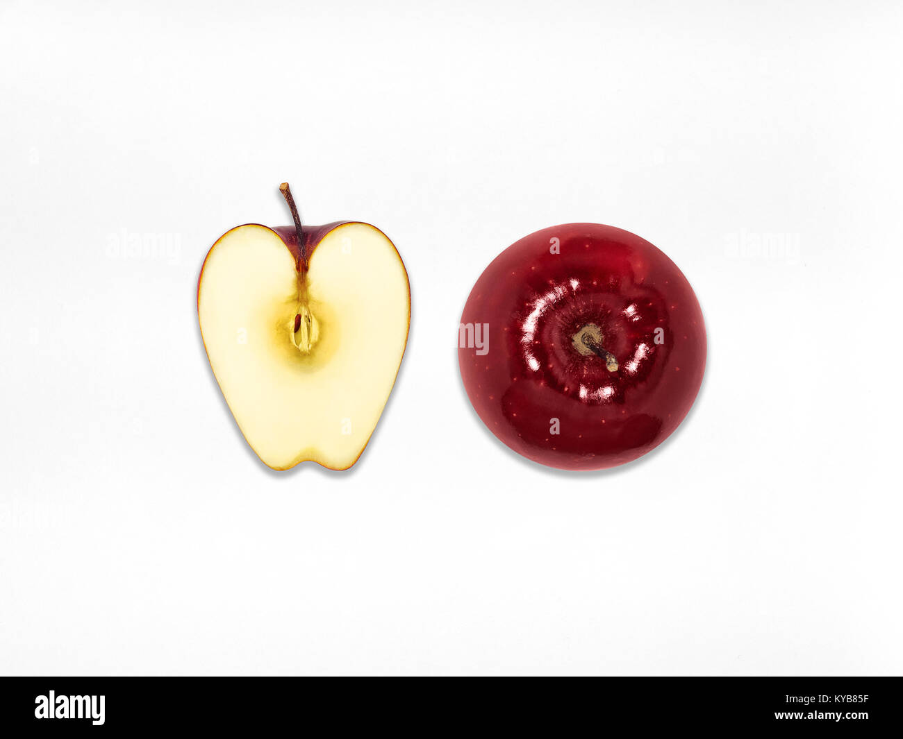 Red apple Top view One whole juicy red apple and half of apple are ...