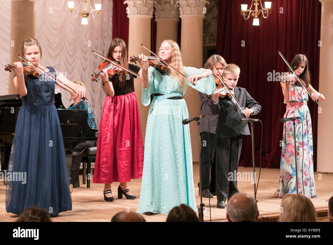 Symphony orchestra first violin section performing Stock Photo - Alamy