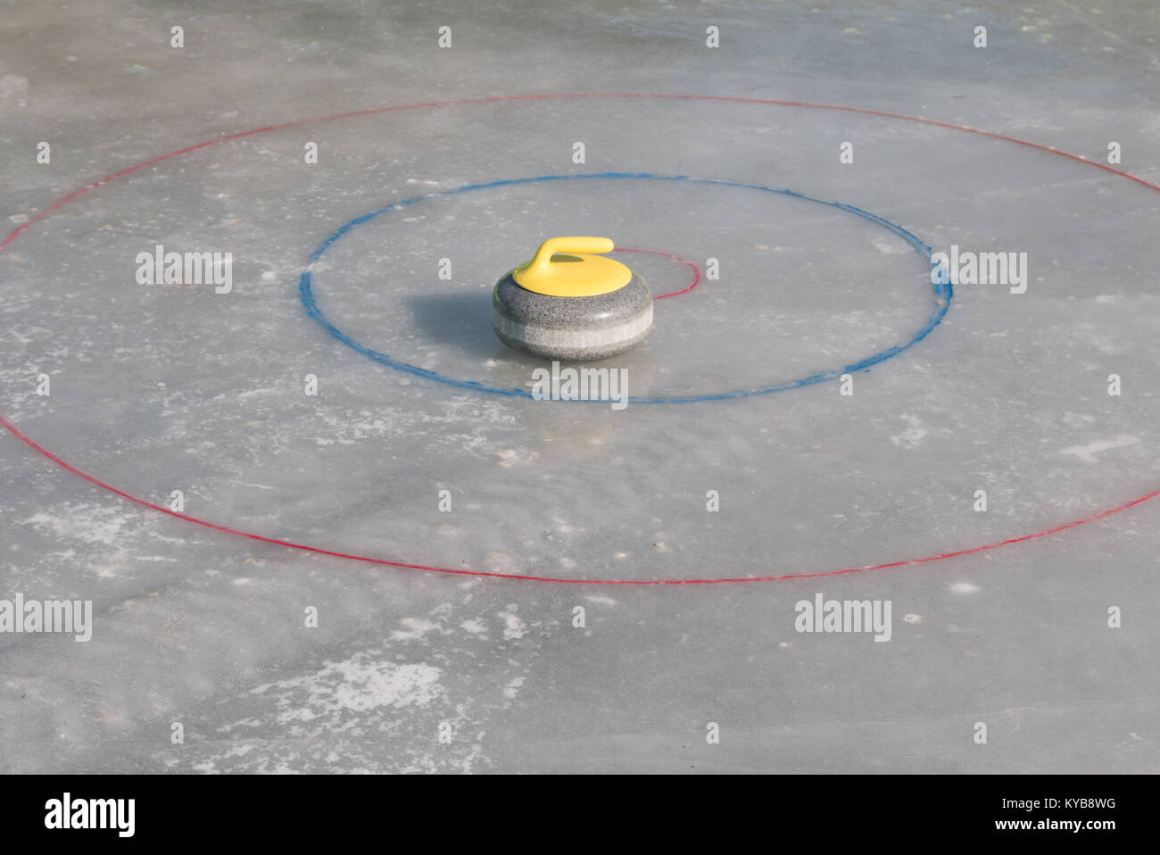 Curling stone on the ice Stock Photo - Alamy