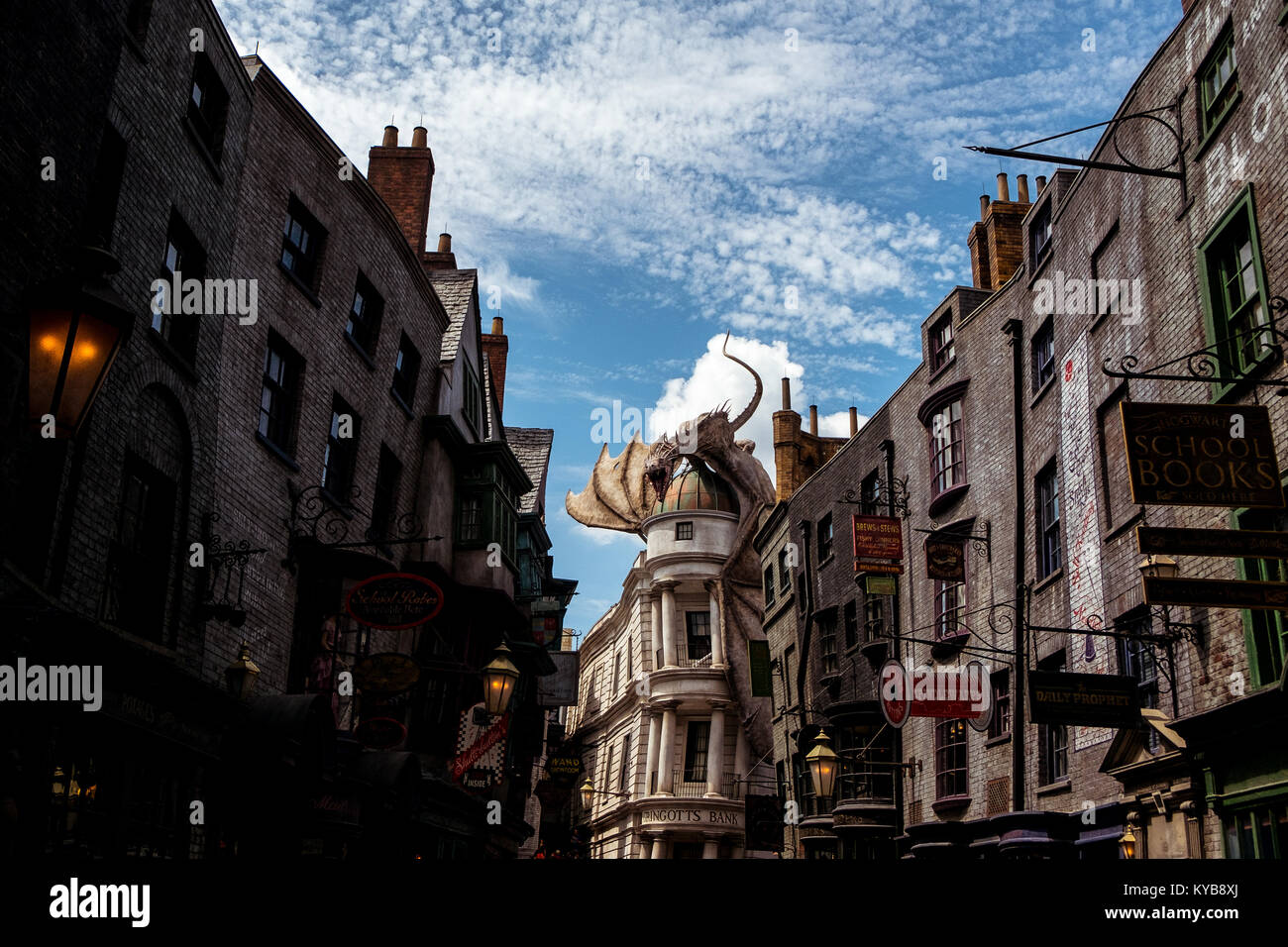 dragon looming over houses in harry potter town in summer day Stock ...