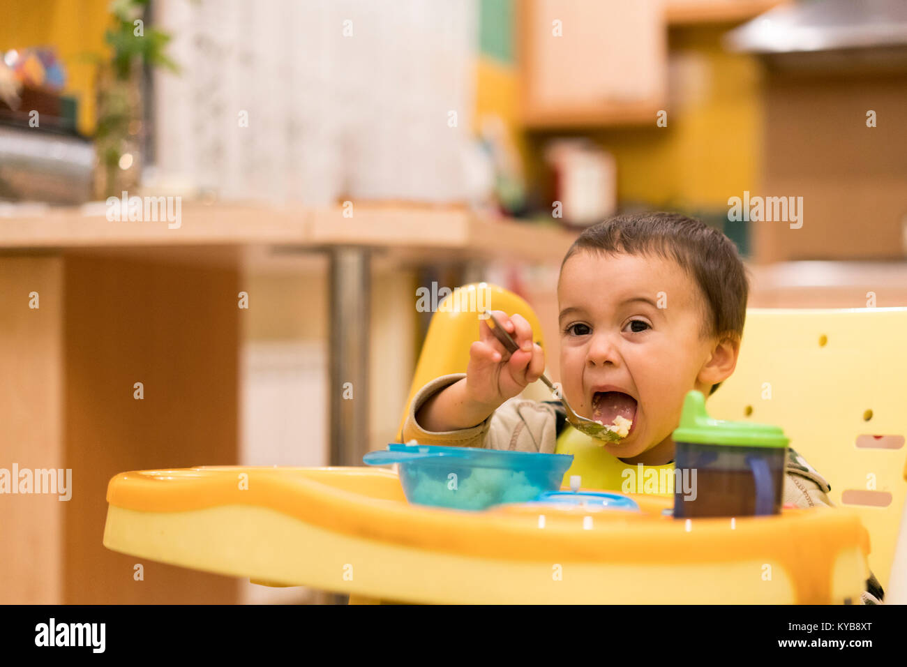 little boy 1 year old eating potatoes Stock Photo - Alamy