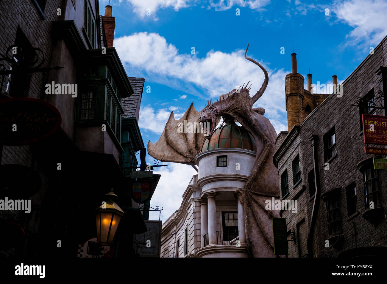 dragon looming over houses in harry potter town in summer day Stock ...