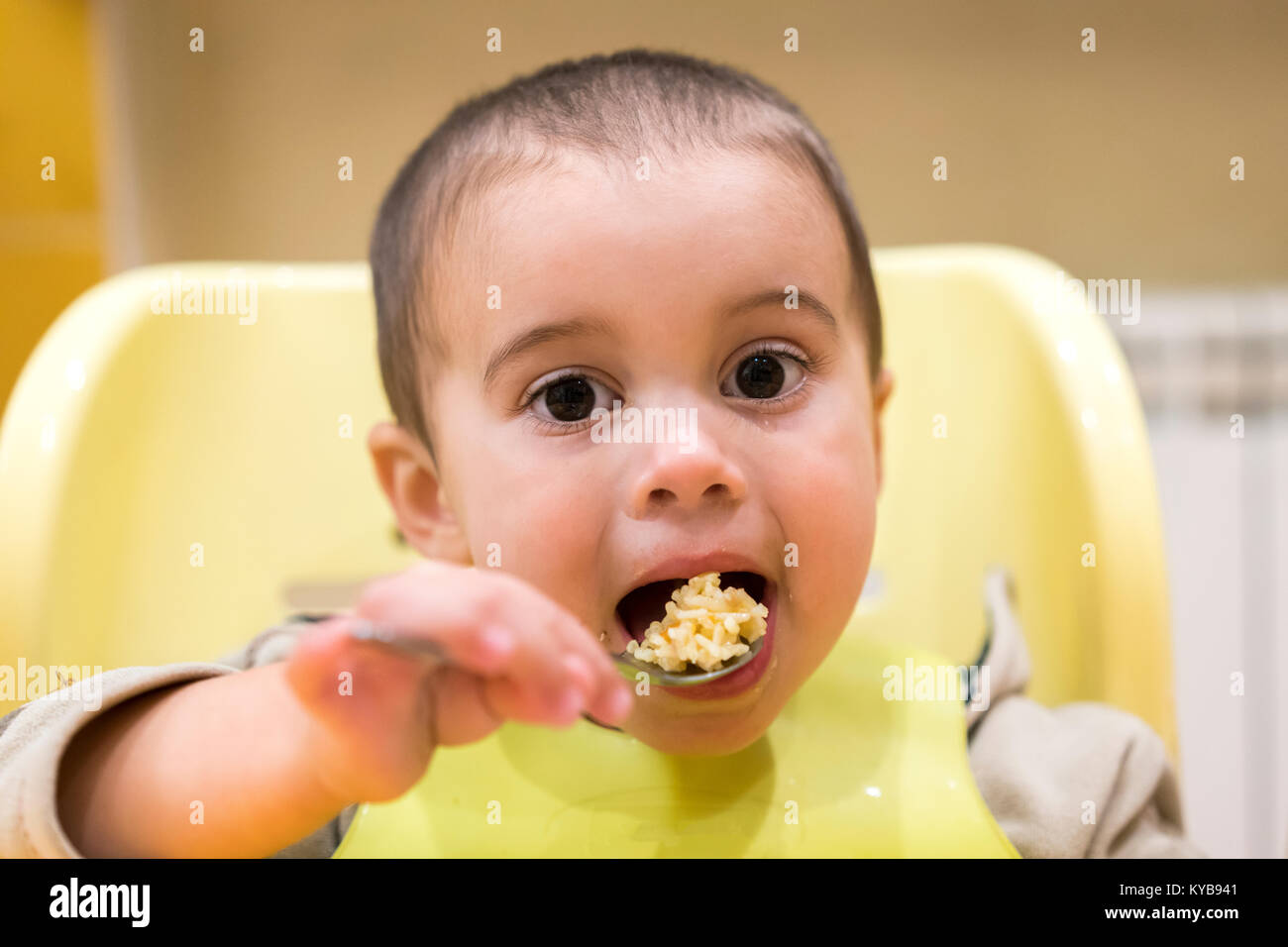 baby 1 year eating a spoon Stock Photo - Alamy