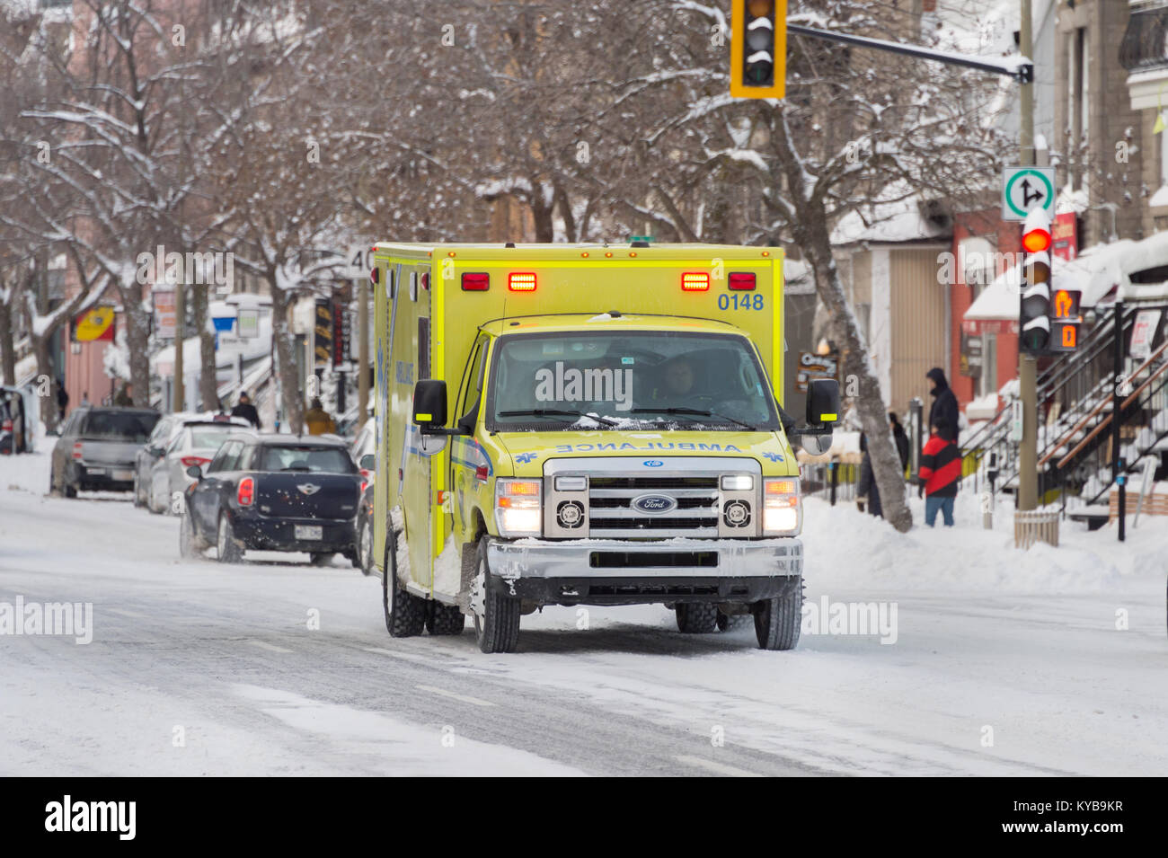 Montreal, CANADA - 13 January 2018: ambulance driving on Saint Denis ...