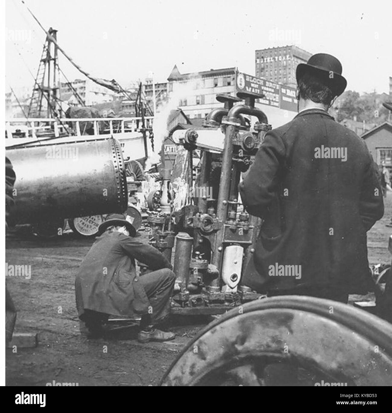 A historical photograph from October 1897 depicting men loading ...