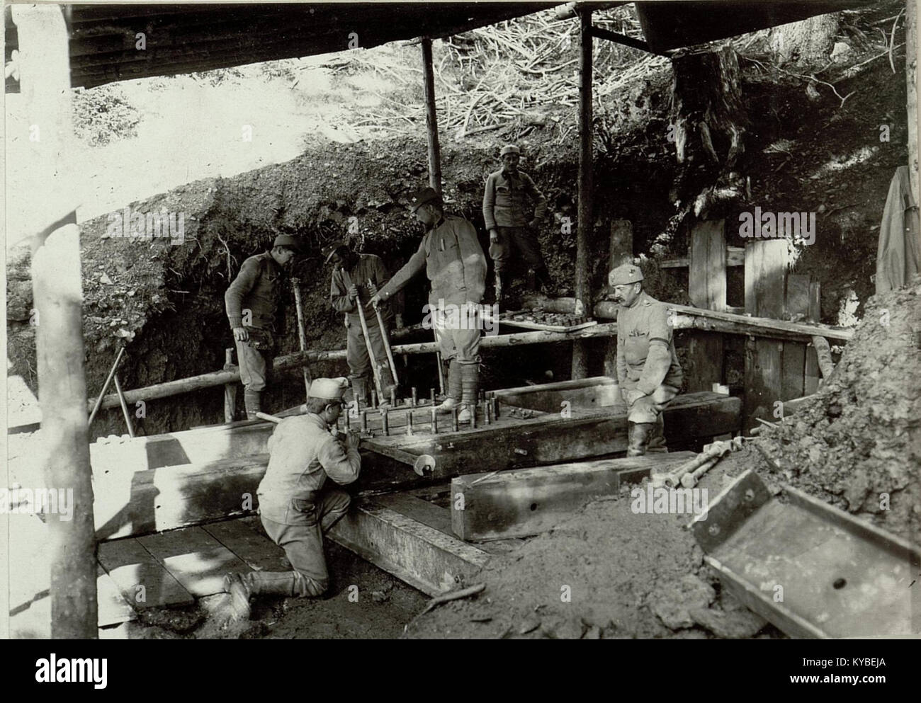 This image depicts assembly work on a naval cannon, illustrating the ...
