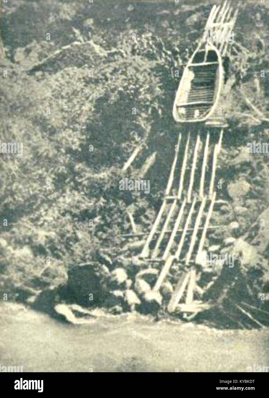 Photograph showing the process of lowering boats down a steep mountain ...