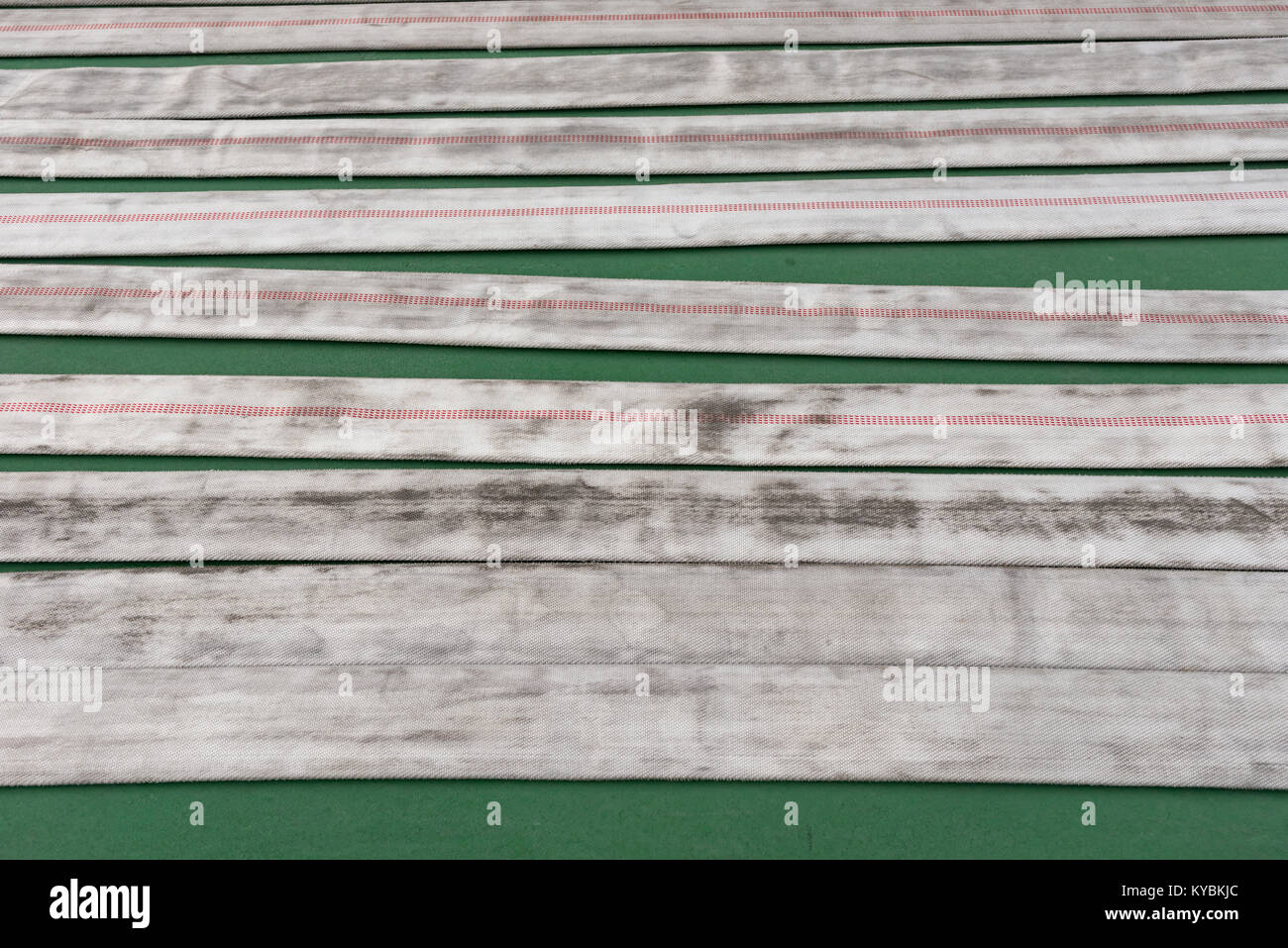 fire hoses on floor as background Stock Photo - Alamy