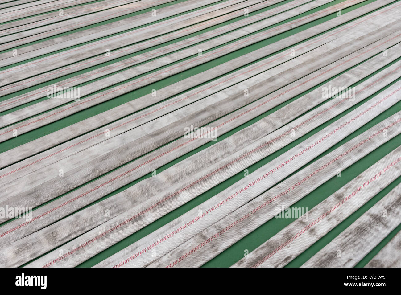 fire hoses on floor as background Stock Photo - Alamy