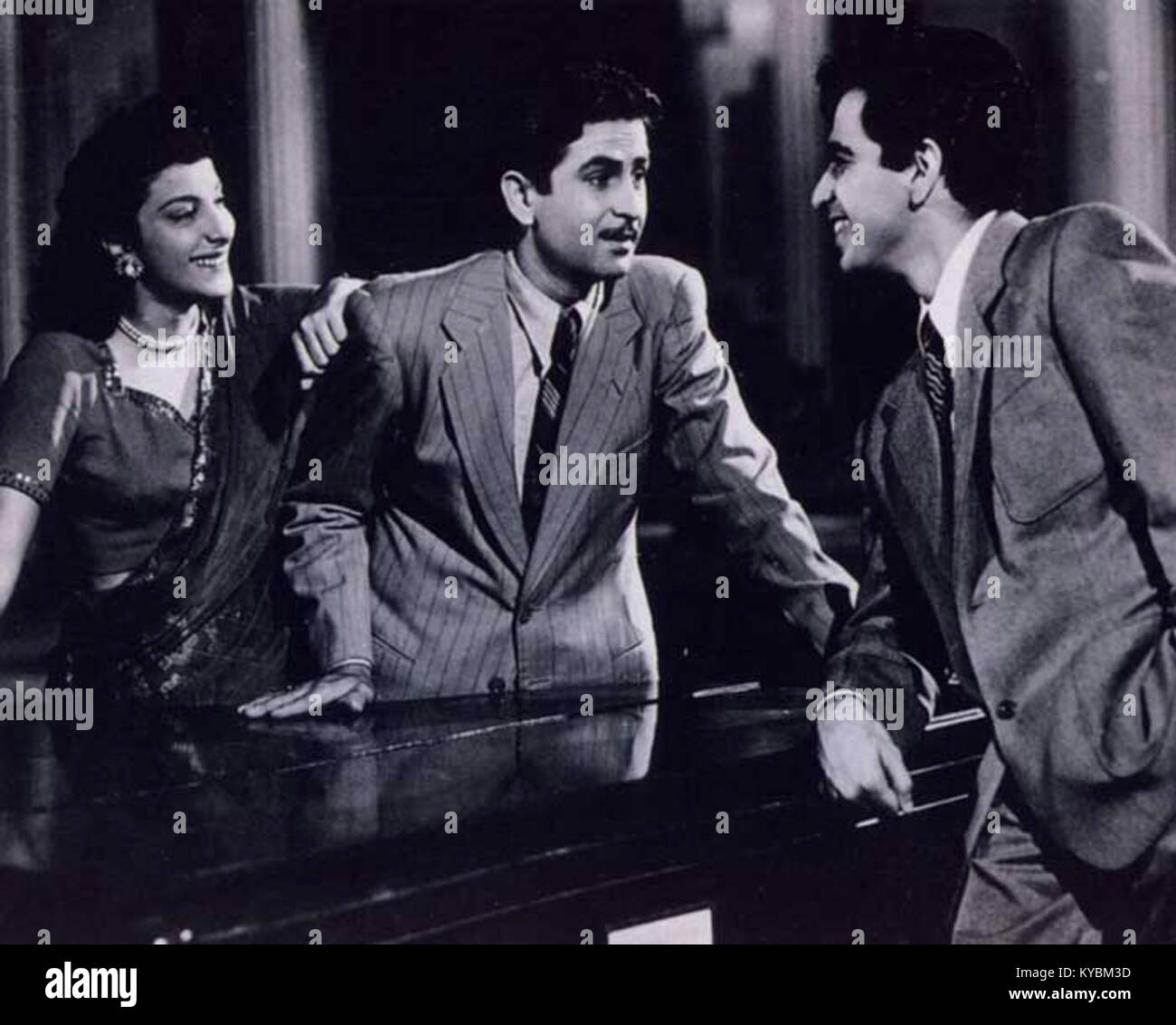 A classic scene from the Bollywood film *Andaz* featuring the iconic trio of Nargis, Raj Kapoor ...