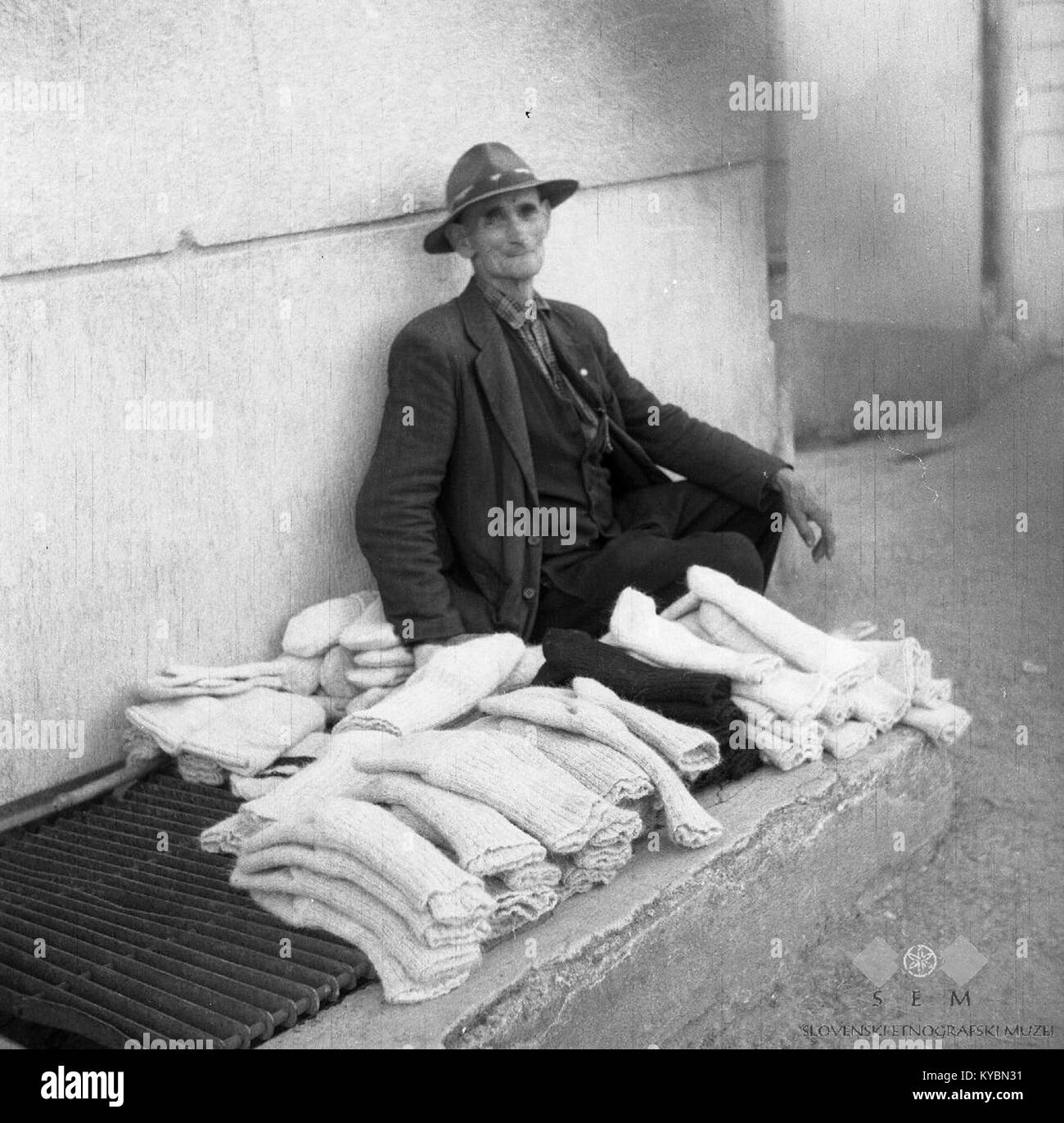 The photograph titled “At the fair in Metlika – Croatian seller, socks ...