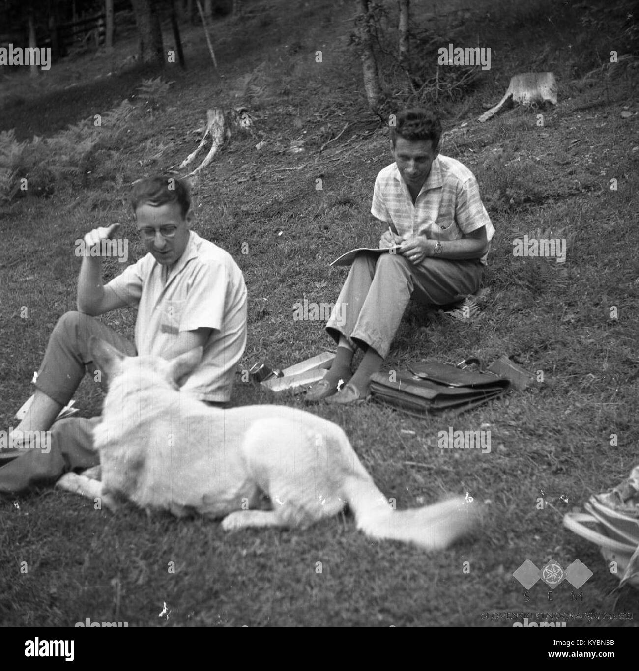 A photograph showing workers Mihevc and Makarovič at work and during a ...