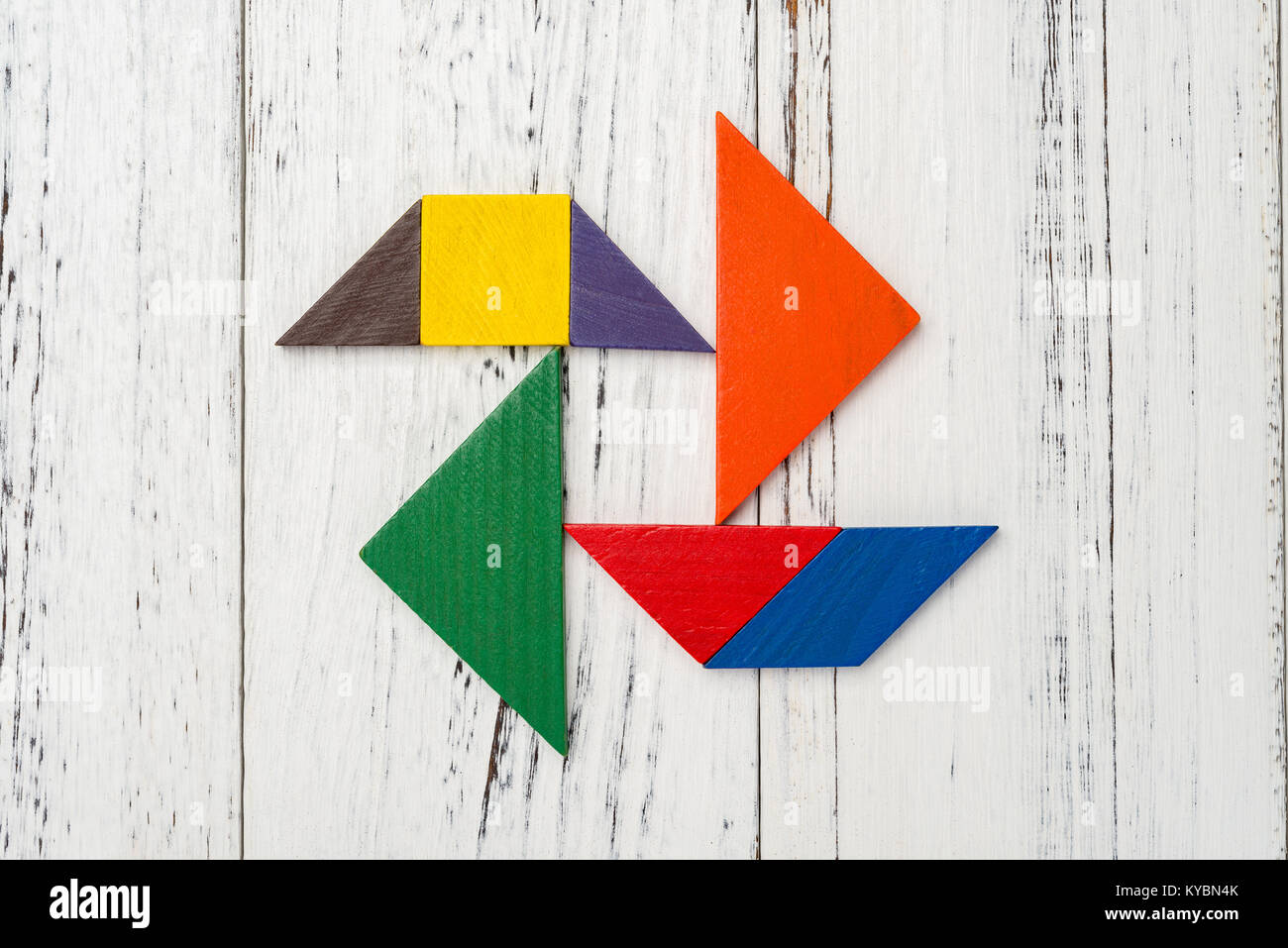 wooden tangram in a pinwheel shape Stock Photo - Alamy